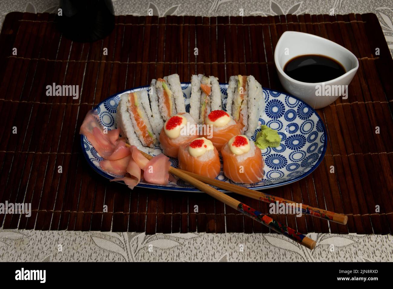 Sushi dish with of fashion sandwiches and Uramaki rolls served with ...