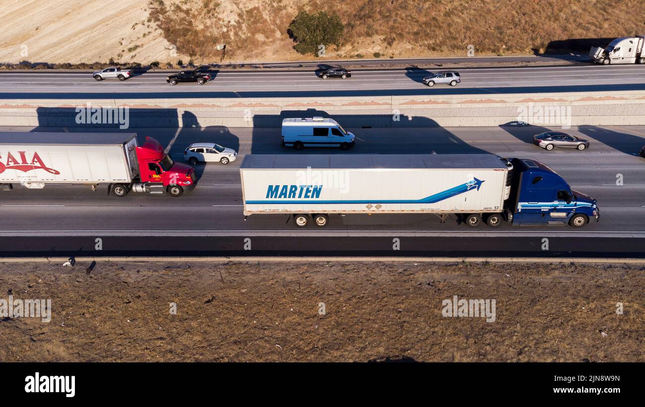 An aerial view of the Interstate 5 freeway with lots of cars and ...