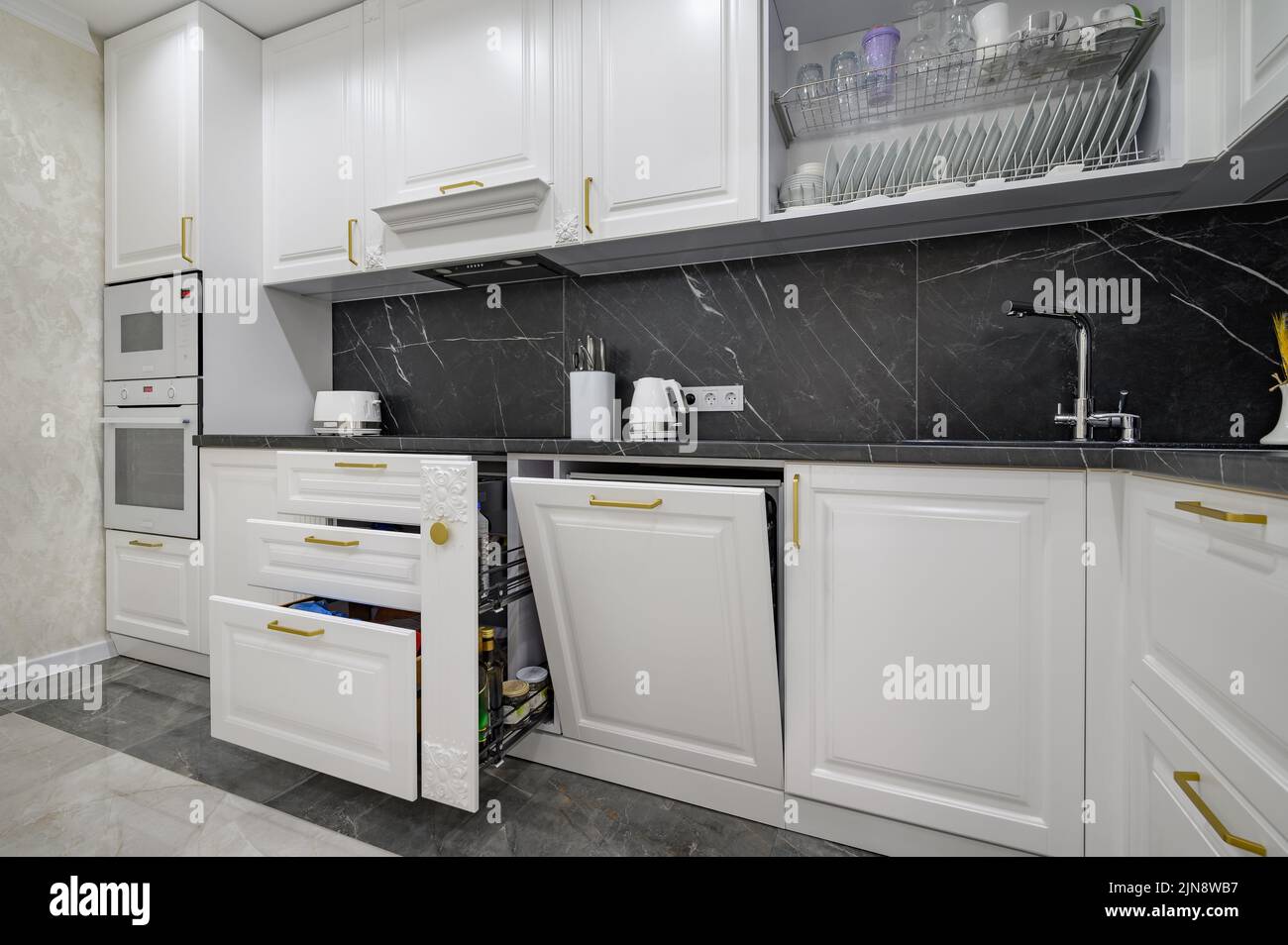 Large white modern domestic kitchen furniture, drawers retracted Stock ...