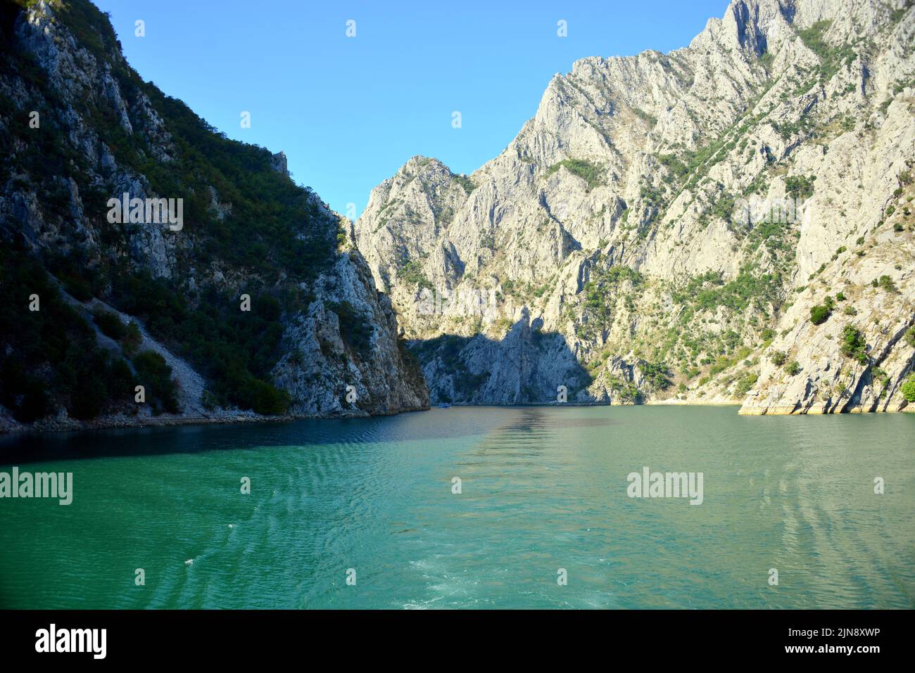 Lake Koman is a reservoir on the Drin River in northern Albania ...