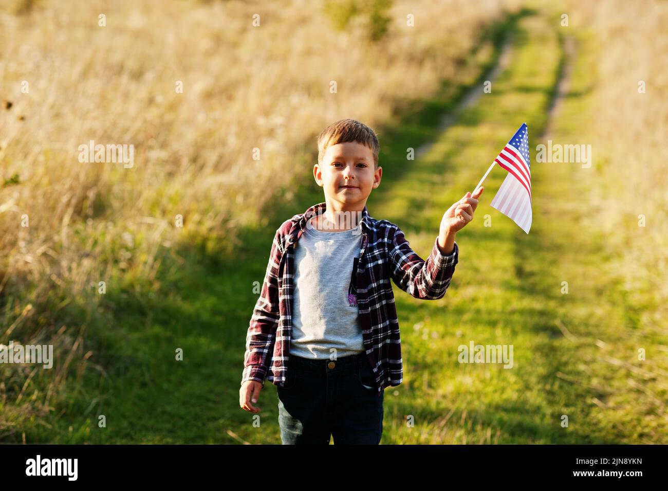 Little boy with USA flag outdoor. America celebrating Stock Photo - Alamy