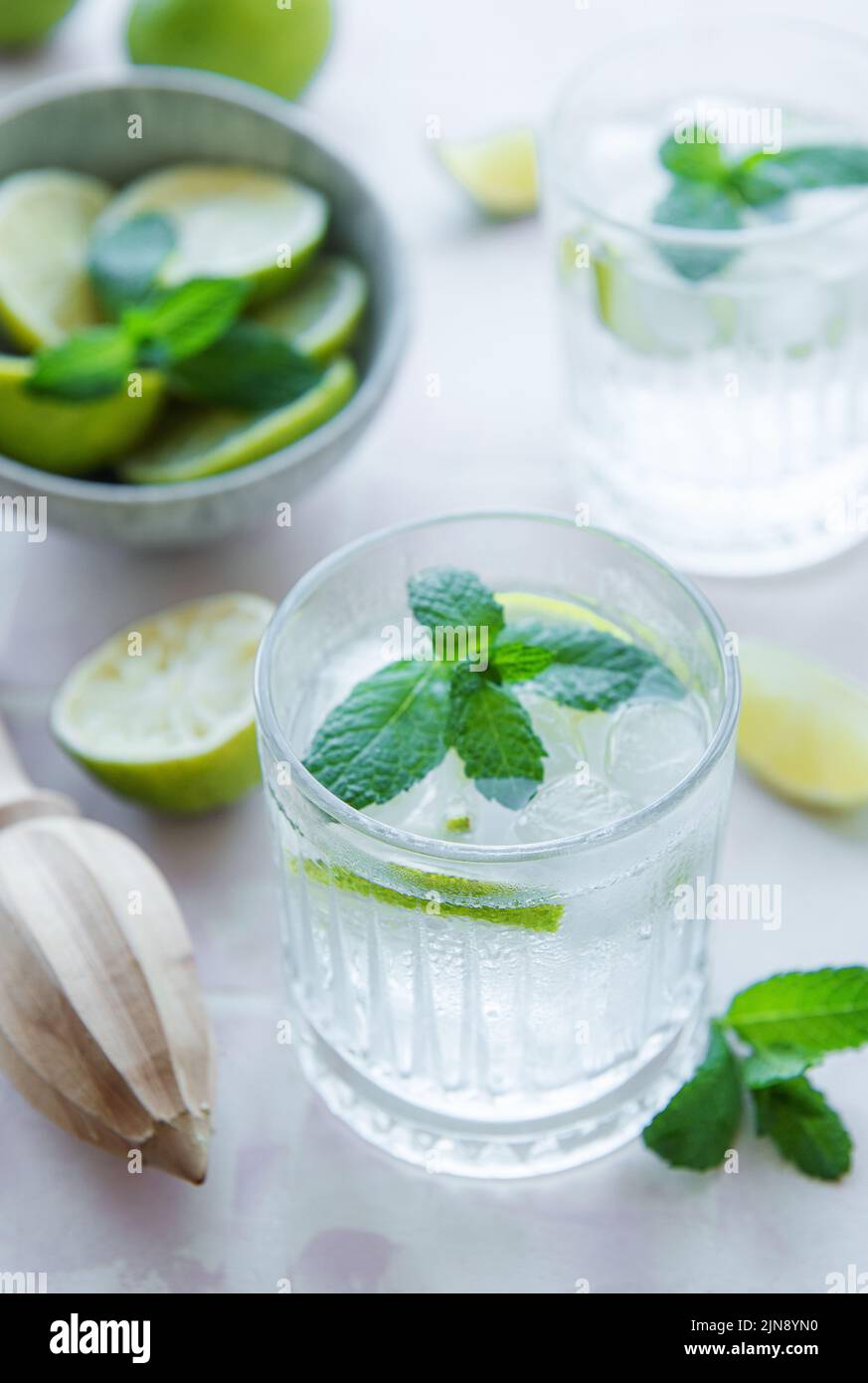 Iced cold lemonade with fresh lime and juice. Summer drink in glass ...