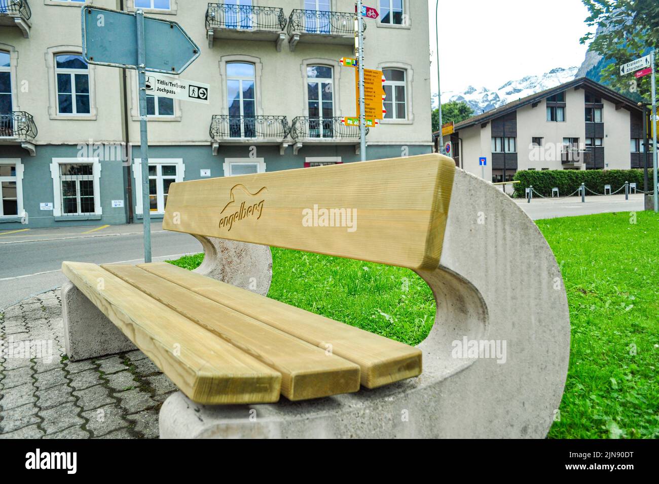 A futuristic bench made from wood and concrete in a park, Engelberg ...