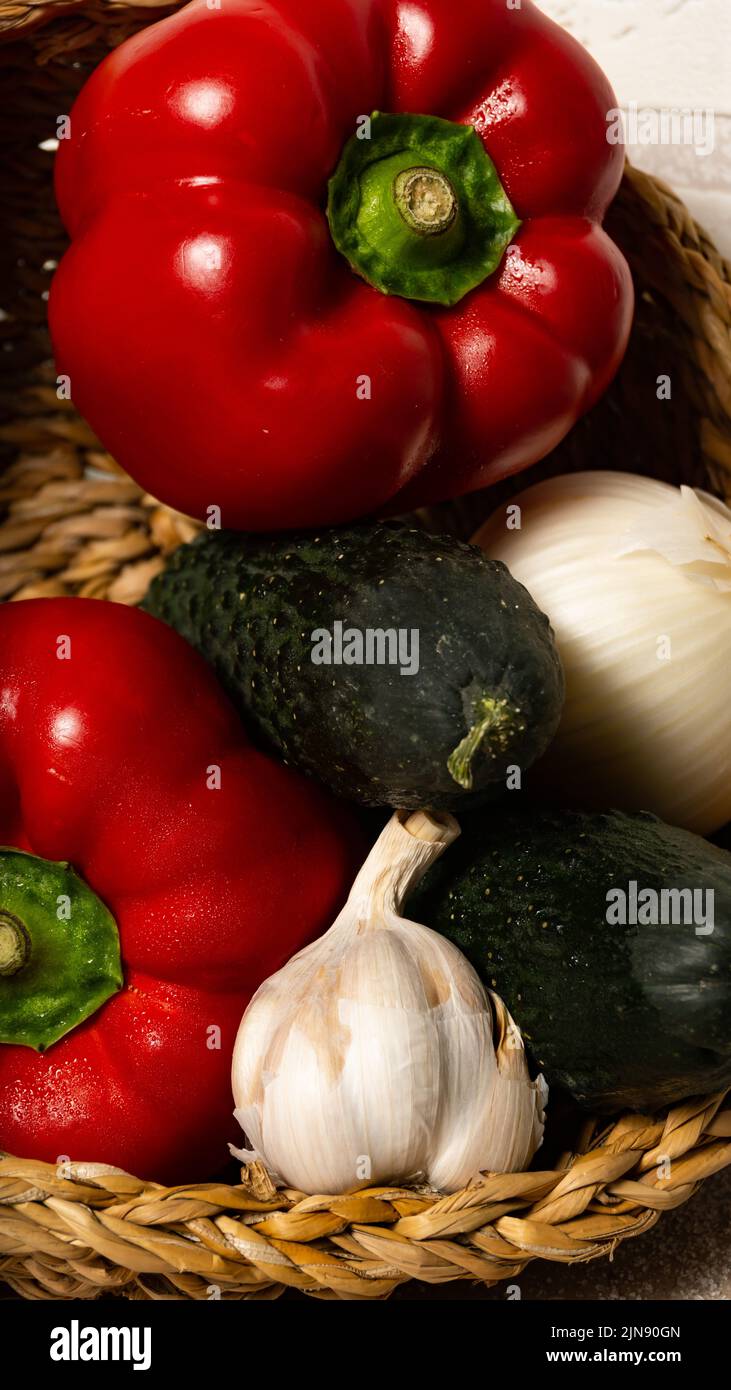 A vertical shot of vegetables in a straw basket Stock Photo - Alamy