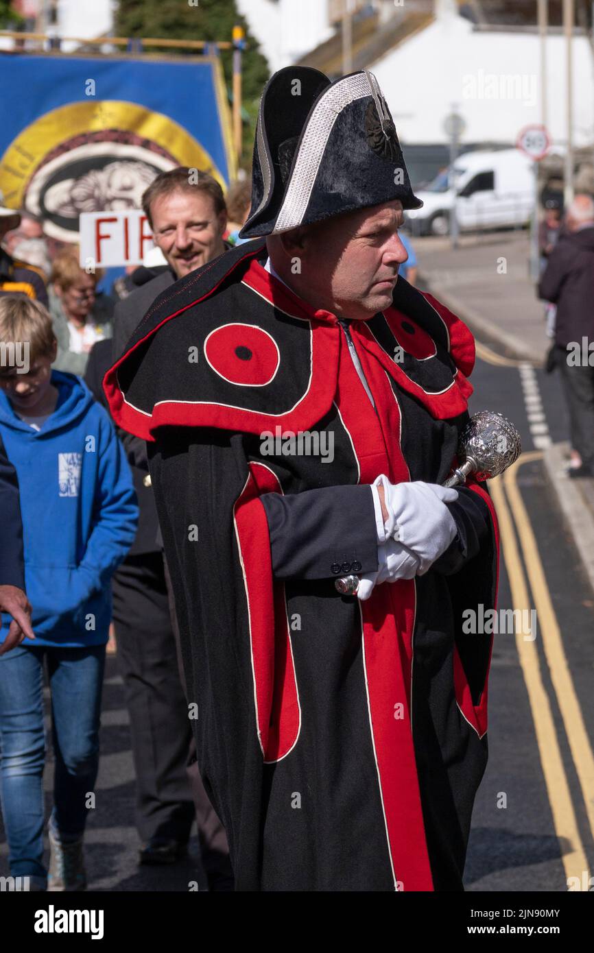 A Mace Bearer leading the Civic Parade during Mazey Day Golowan ...