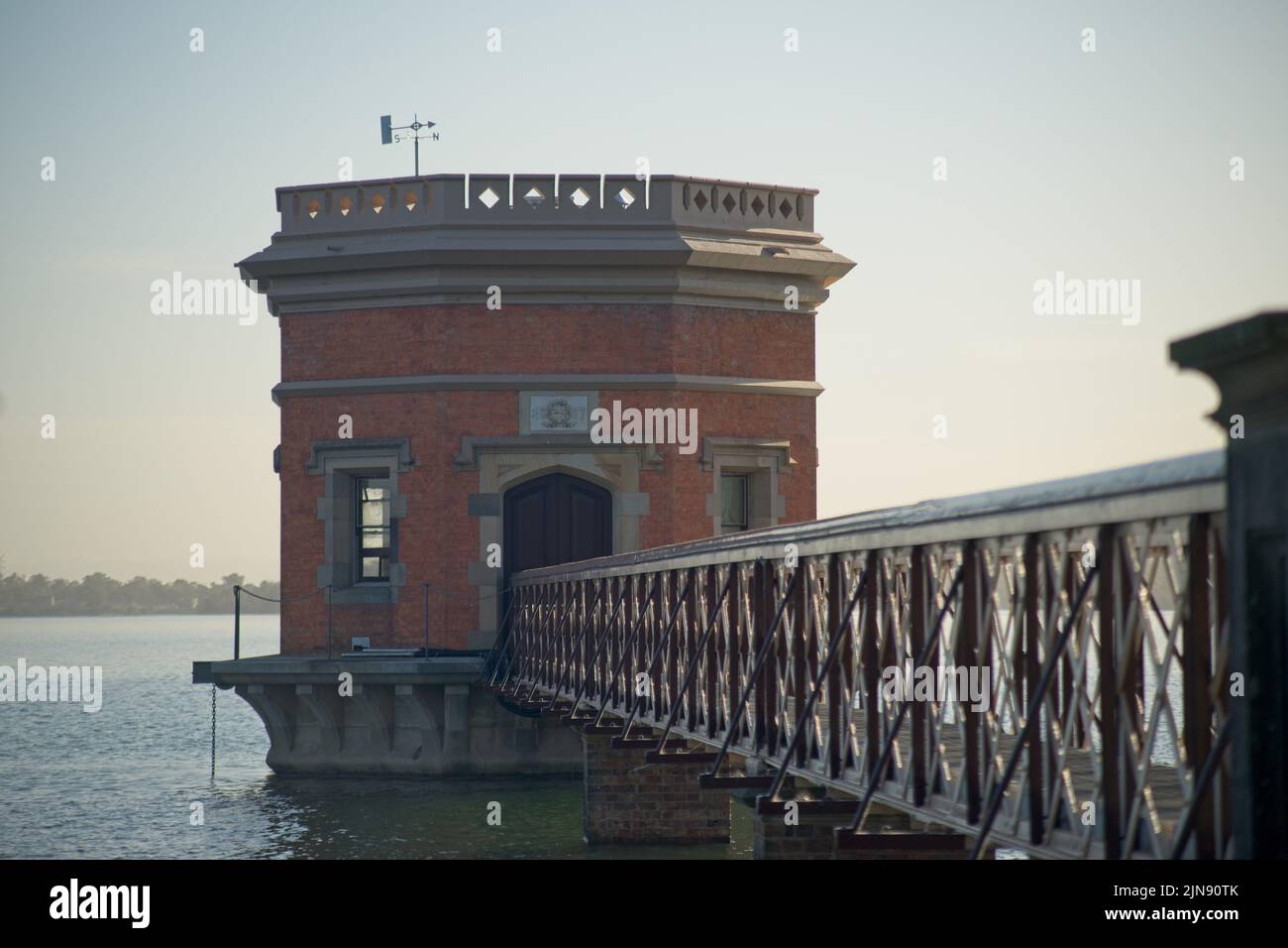 A view of a brick building on a pier in Prospect Reservoir, Australia ...