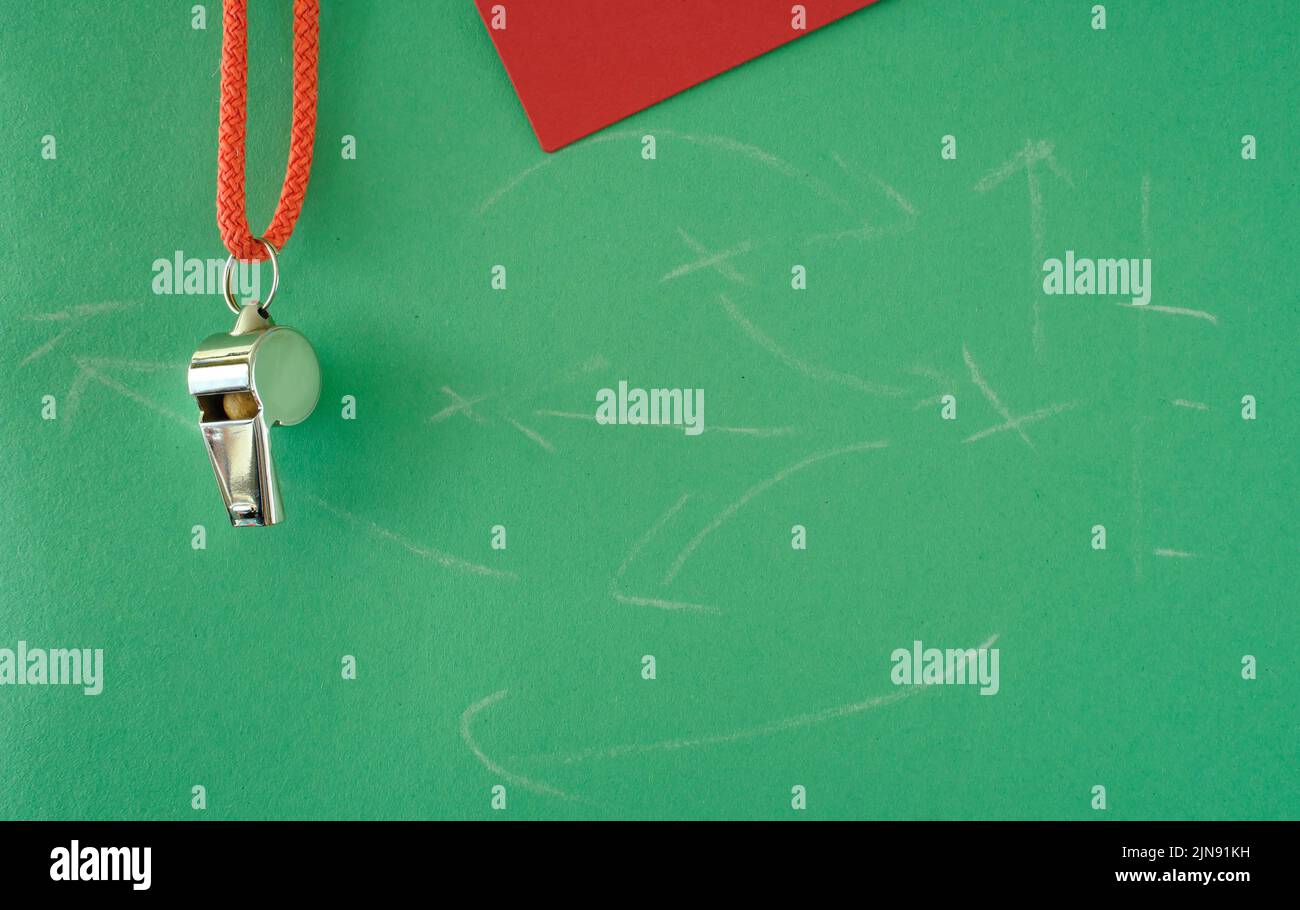 Whistle and red card of soccer referee or trainer and soccer tactics ...