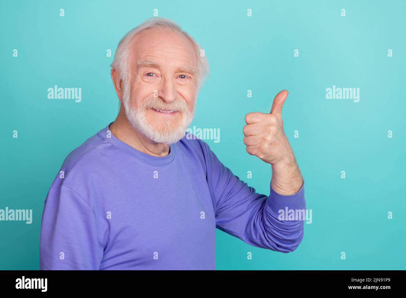 Portrait of cheerful nice person arm finger demonstrate thum up fine ...