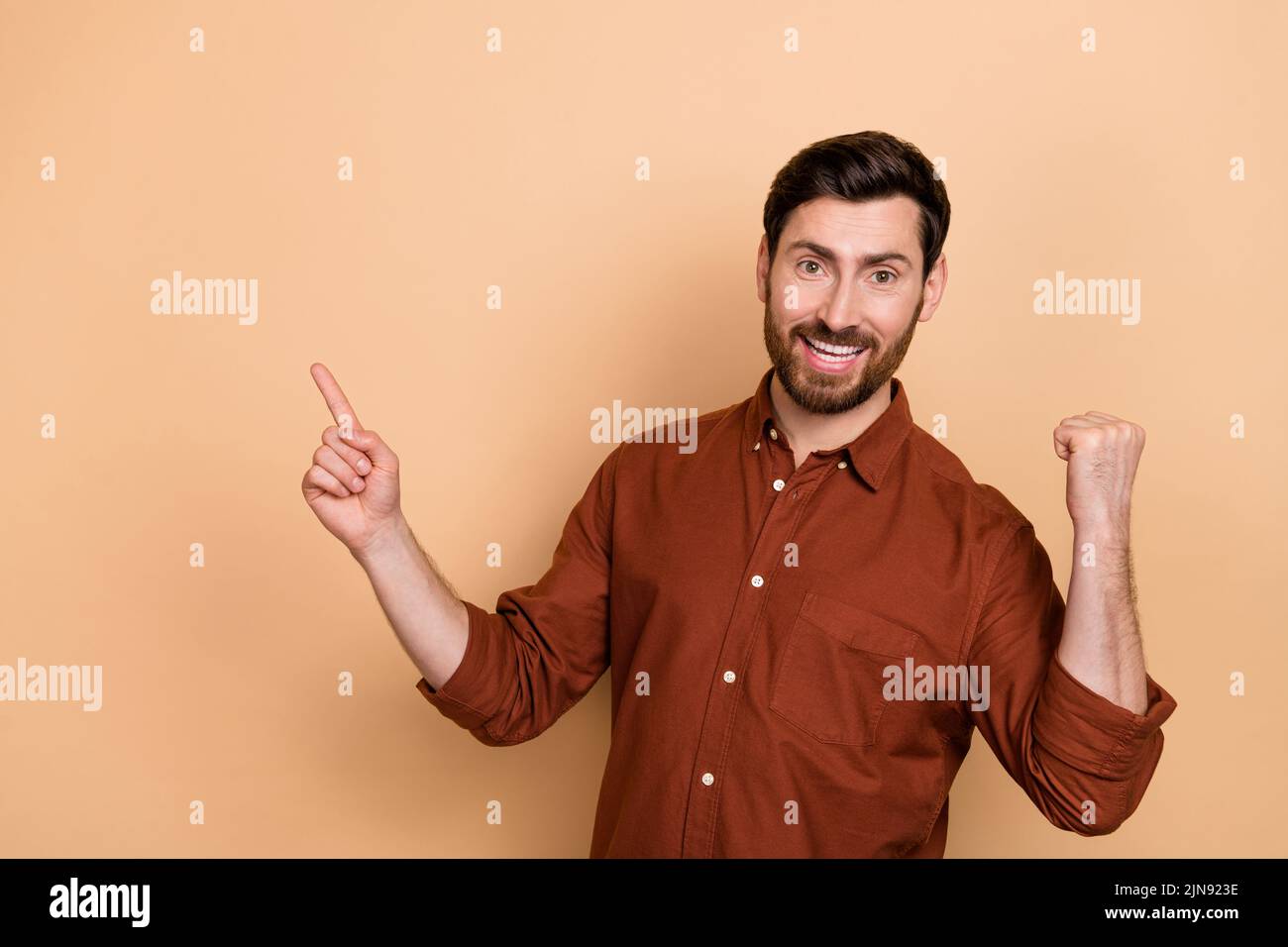 Photo of successful glad person raise fist celebrate achievement direct ...