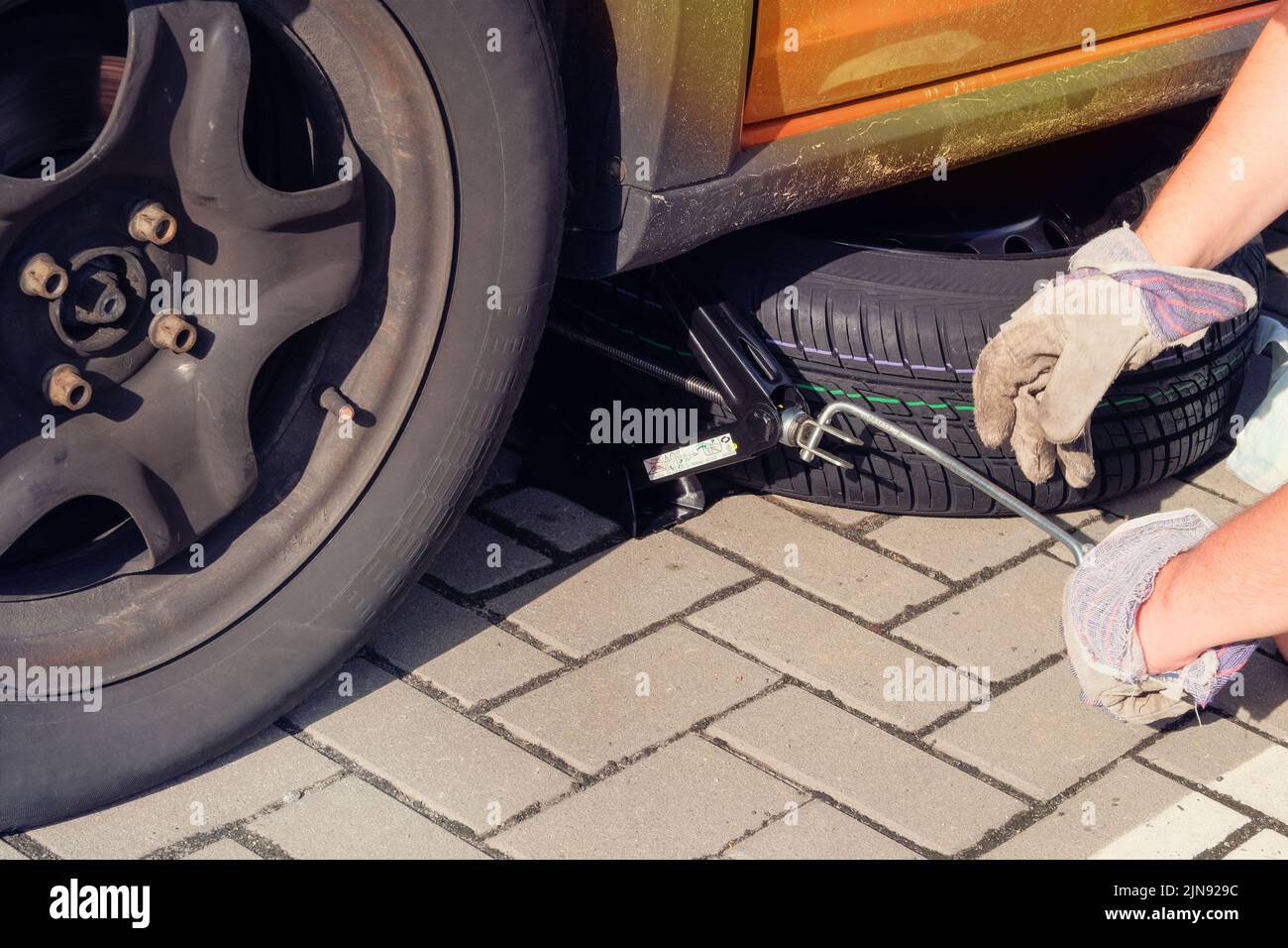 Car repair. Technicians are changing tires. Wheel balancing or repair ...