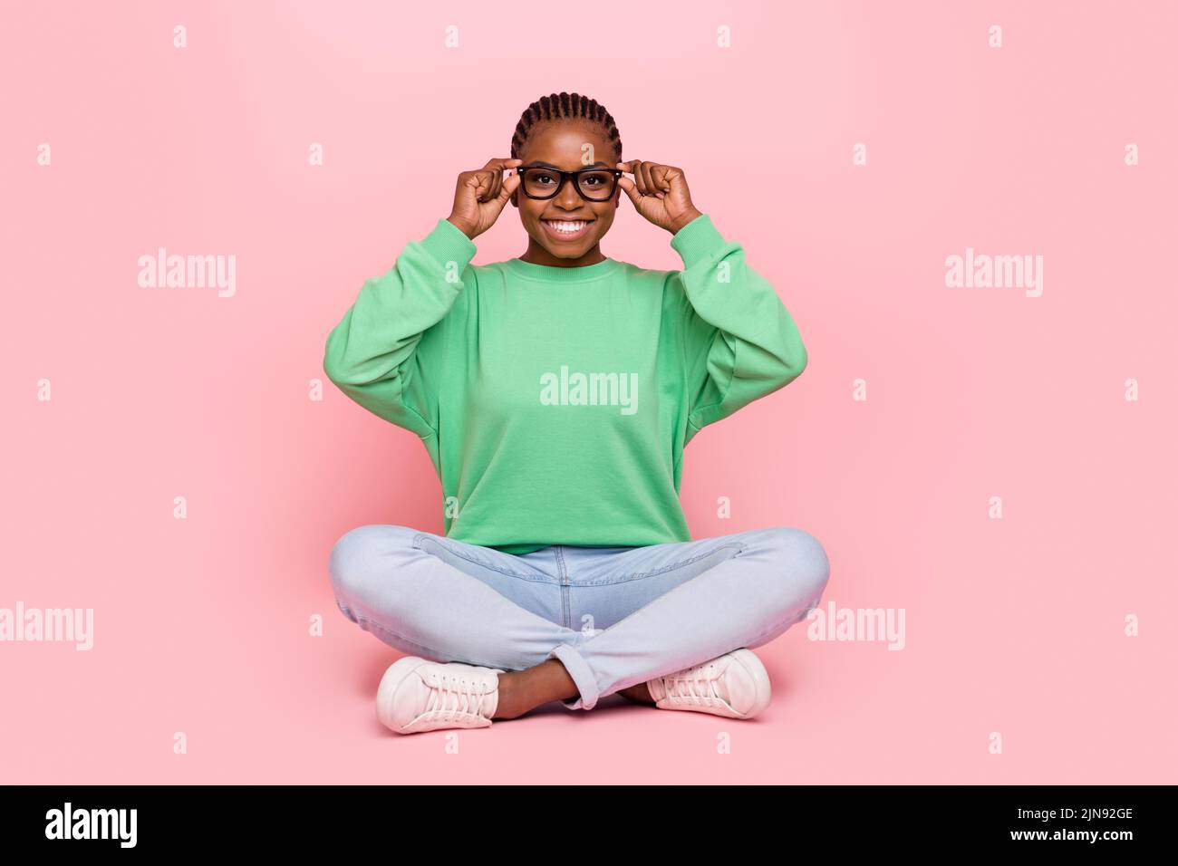 Full size photo of cheerful pretty girl sit floor hands touch glasses ...