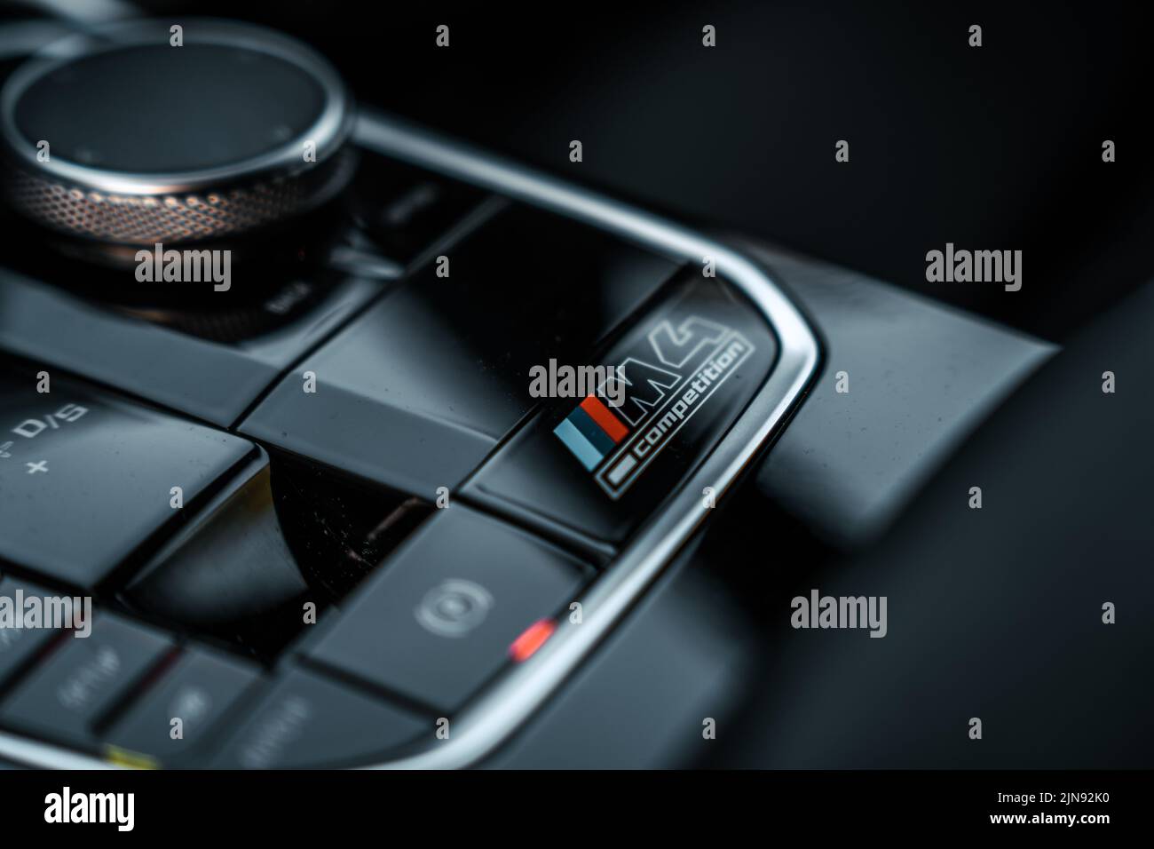A closeup of center console of a BMW M4 Competition, luxury sports car ...