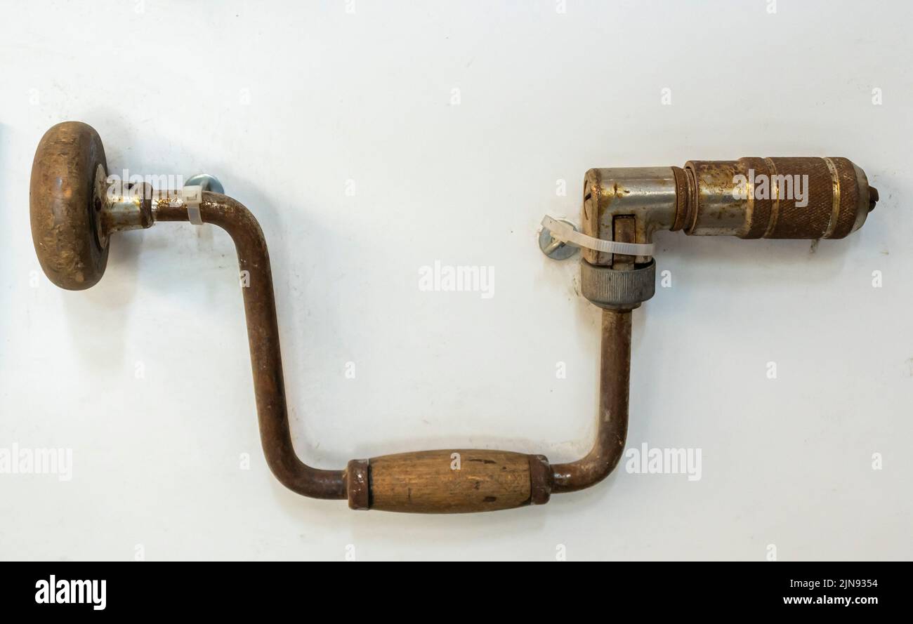 An antique and rusty hand drill Stock Photo - Alamy