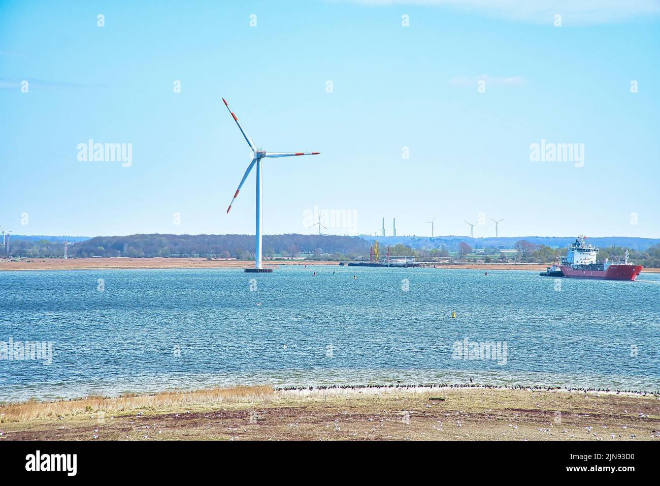 A beautiful view of wind generator across the water Stock Photo - Alamy