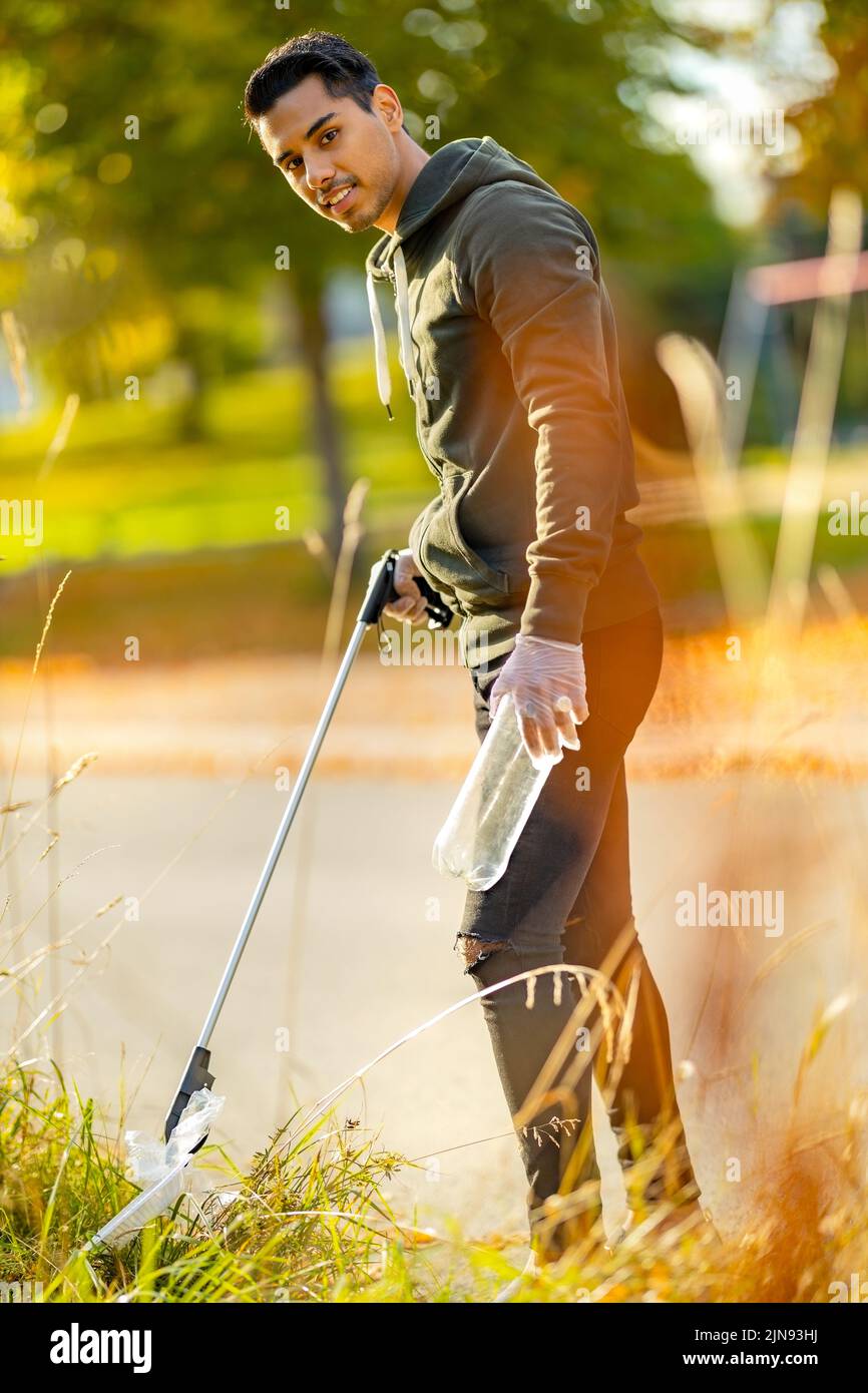 Male volunteer conserving environment from pollution and plastic Stock ...