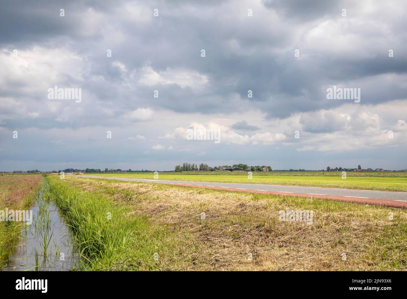The bank of a creek, typical landscape of Holland, flat land and water ...