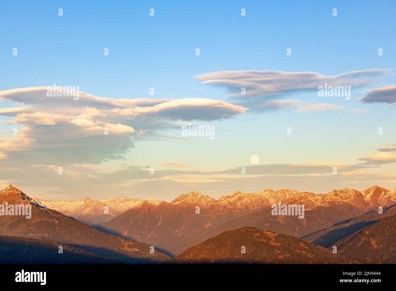 Lenticular cloud above a the alps mountains and a full moon Stock Photo ...
