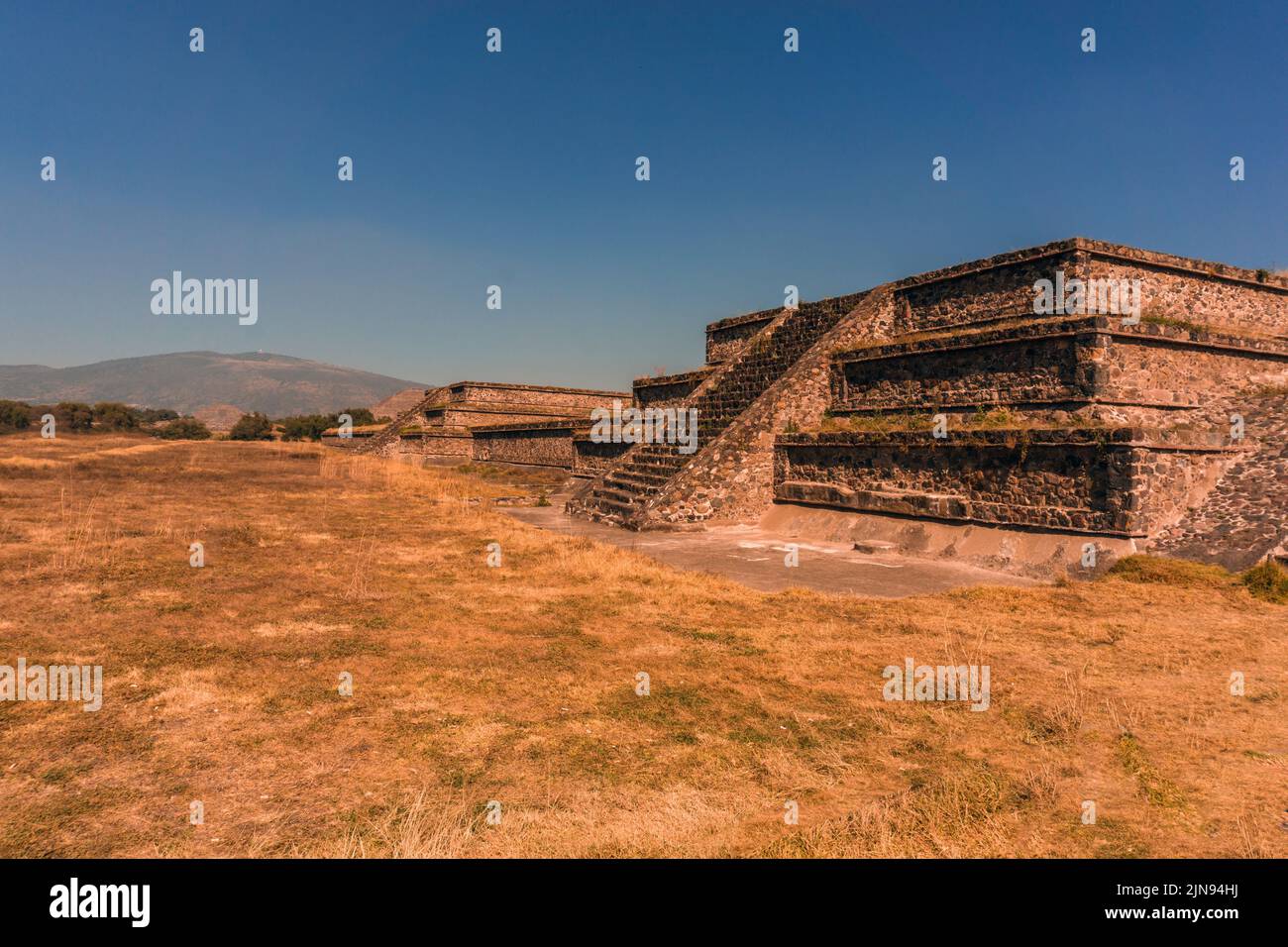 A religious pyramid in Teotihuacan, Mexico on a sunny day with dry ...