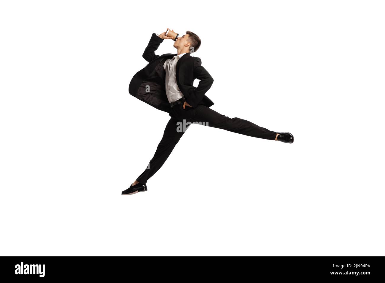 Dynamic portrait of young office worker in business suit in action ...