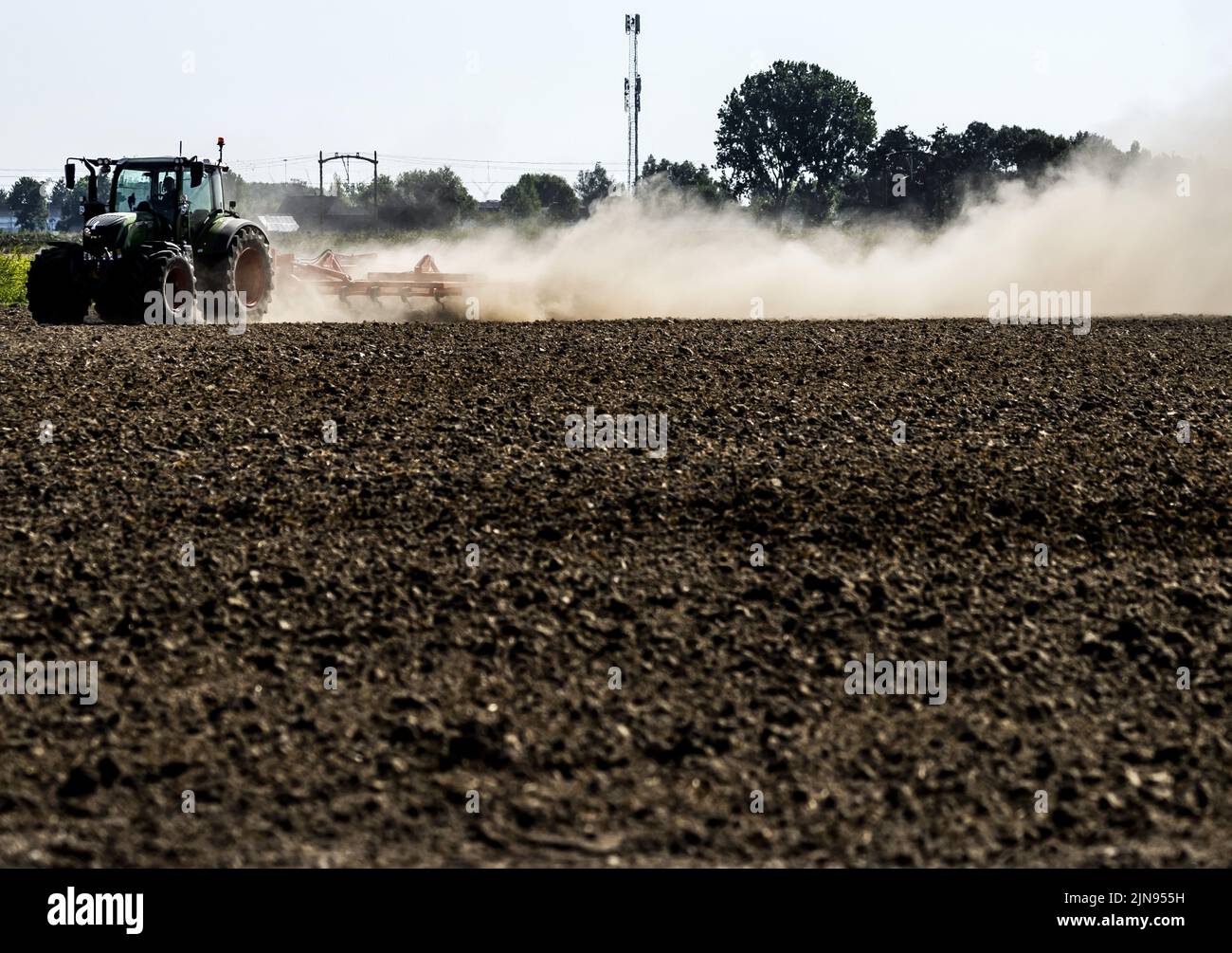 2022-08-10 11:07:20 ZEVENBERGSCHEN HOEK - A farmer plows his dry field ...