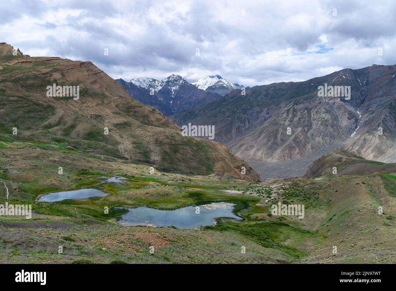 A lake close to Tashigang village, India surrounded by mountains ...