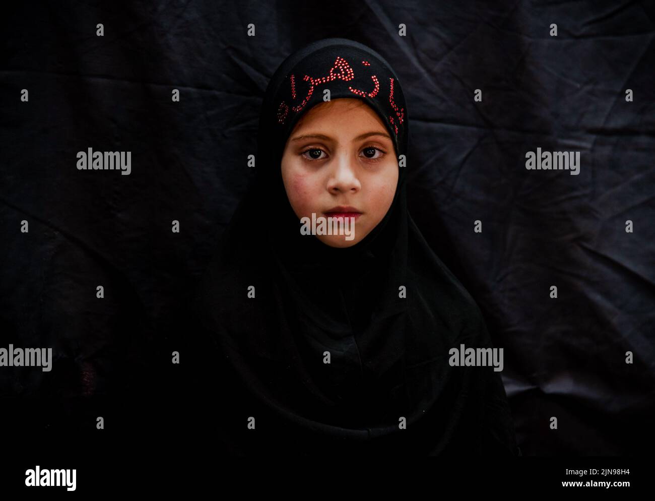 A Shia Muslim girl pose for a picture during Ashura day. Ashura is the ...