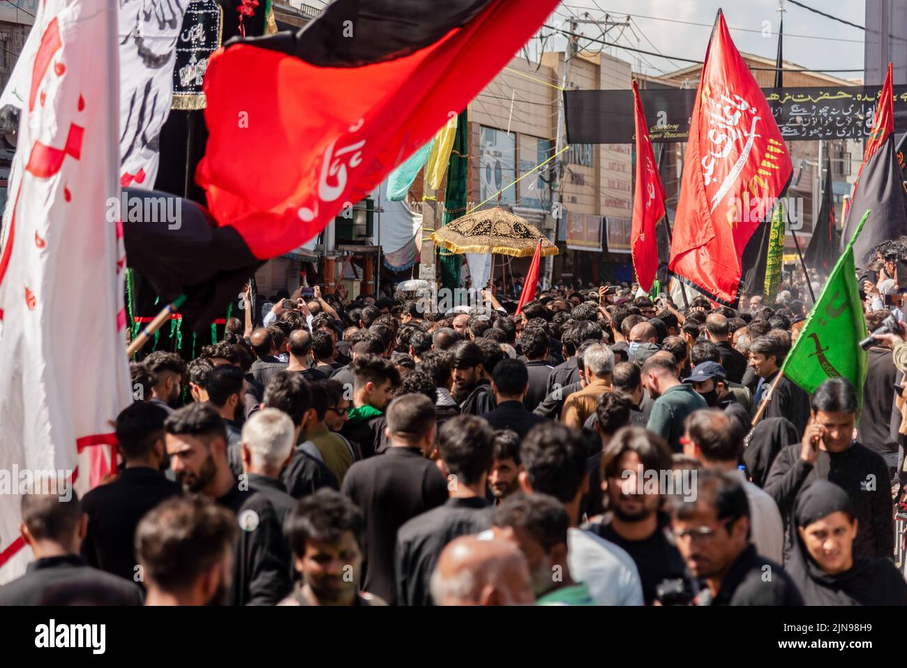 Srinagar, India. 09th Aug, 2022. Shia Muslims wave Alam's during an ...