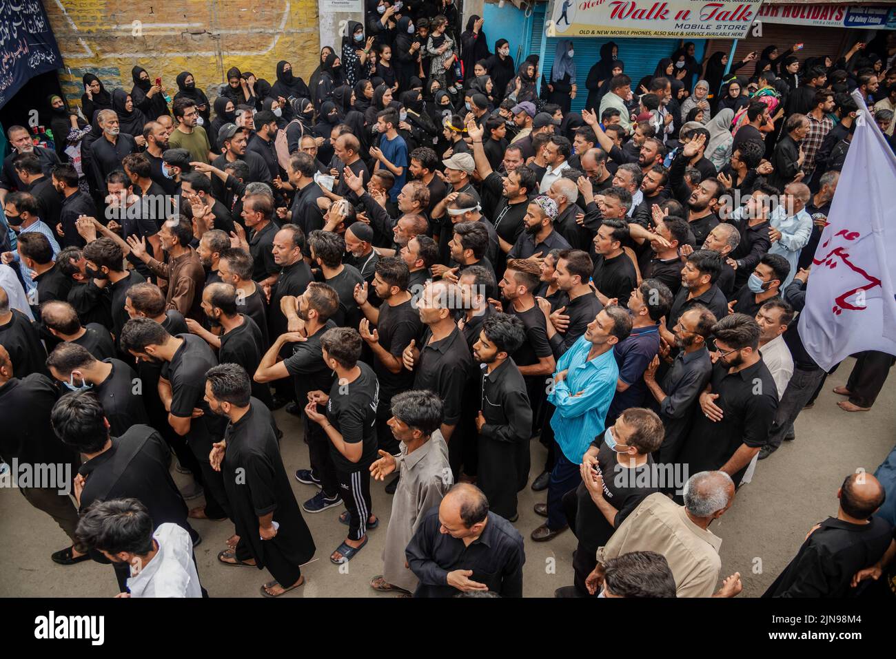 Shia Muslims beat chests as they walk during Ashura procession. Ashura ...