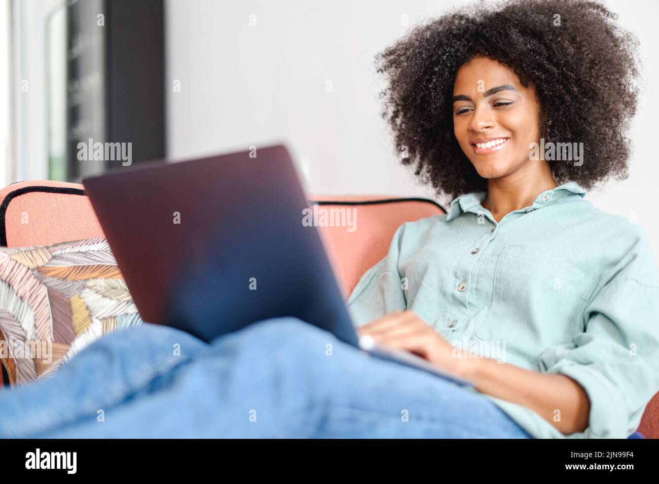 Reading computer screen ethnic hi-res stock photography and images - Alamy