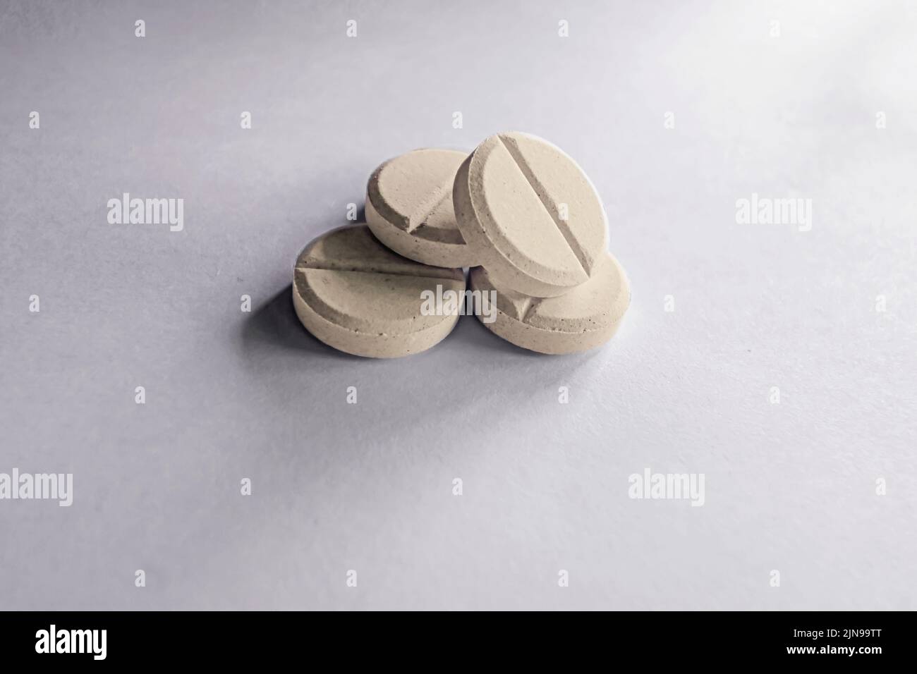 Multivitamin orange effervescent tablets on the seamless beige ...