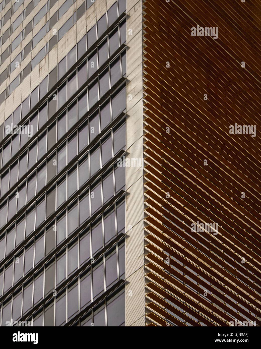 Vertical shot of the corner of a modern and glass building in Paris ...