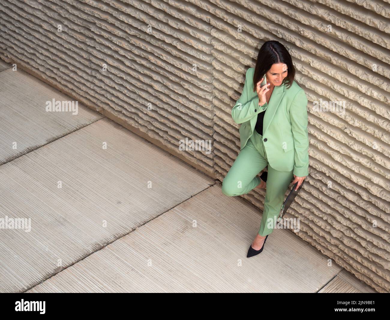 From above full body of female entrepreneur in elegant wear and high ...
