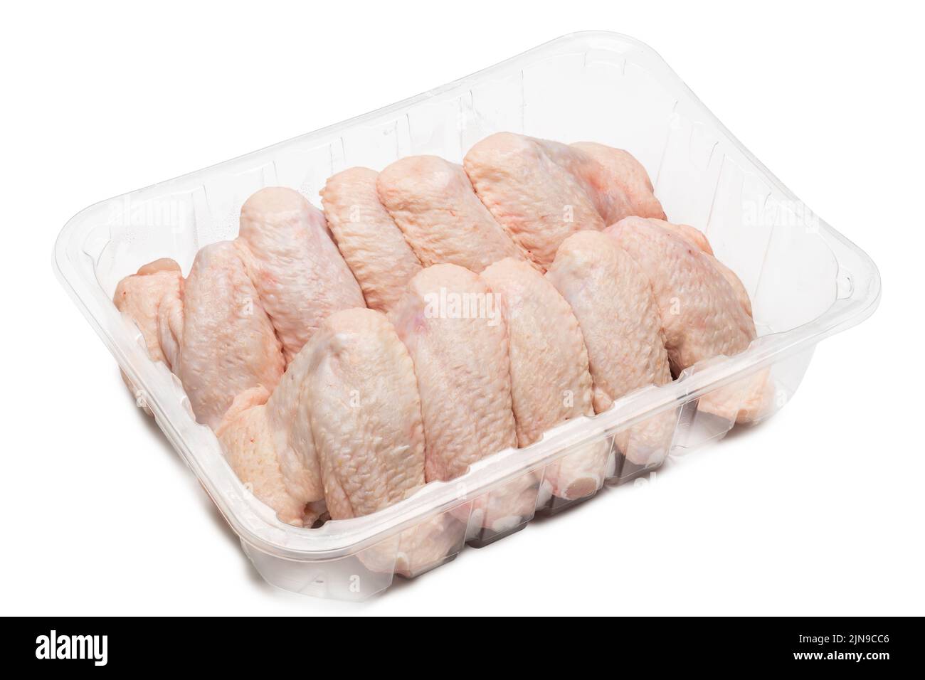 Chicken wings in plastic container isolated on white Stock Photo - Alamy