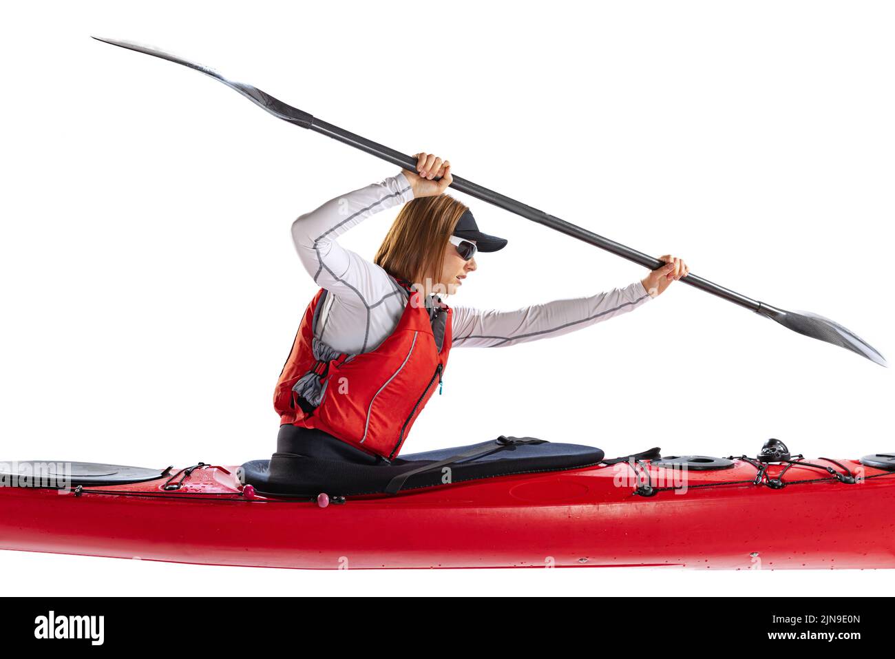 Profile view. Female sportsman in red canoe, kayak with a life vest and ...