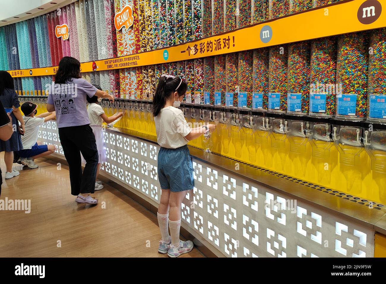 SHANGHAI, CHINA - AUGUST 10, 2022 - Customers shop at the M&M chocolate ...