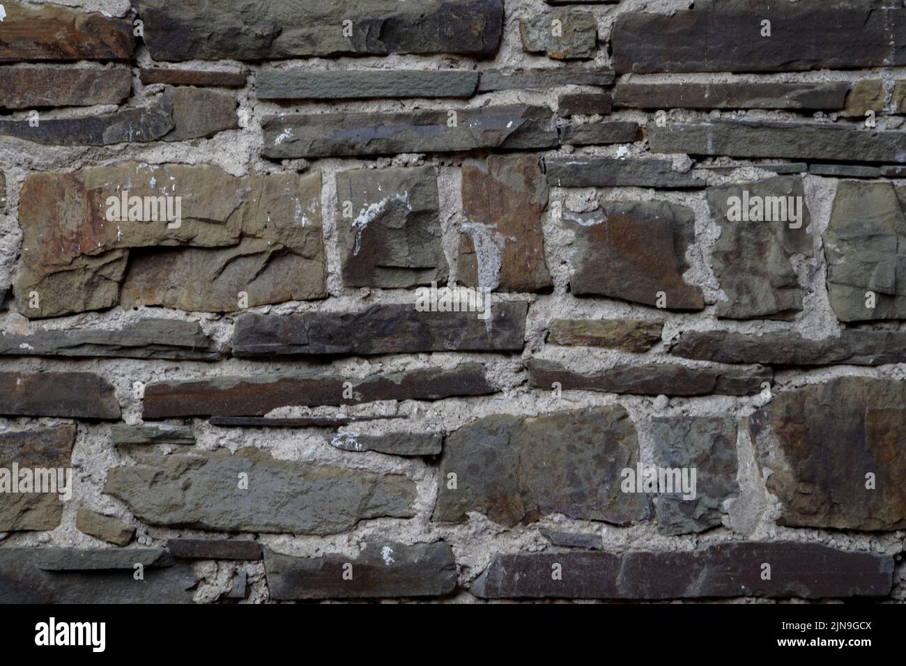 stone wall texture made of rough cut stone with large groves Stock ...