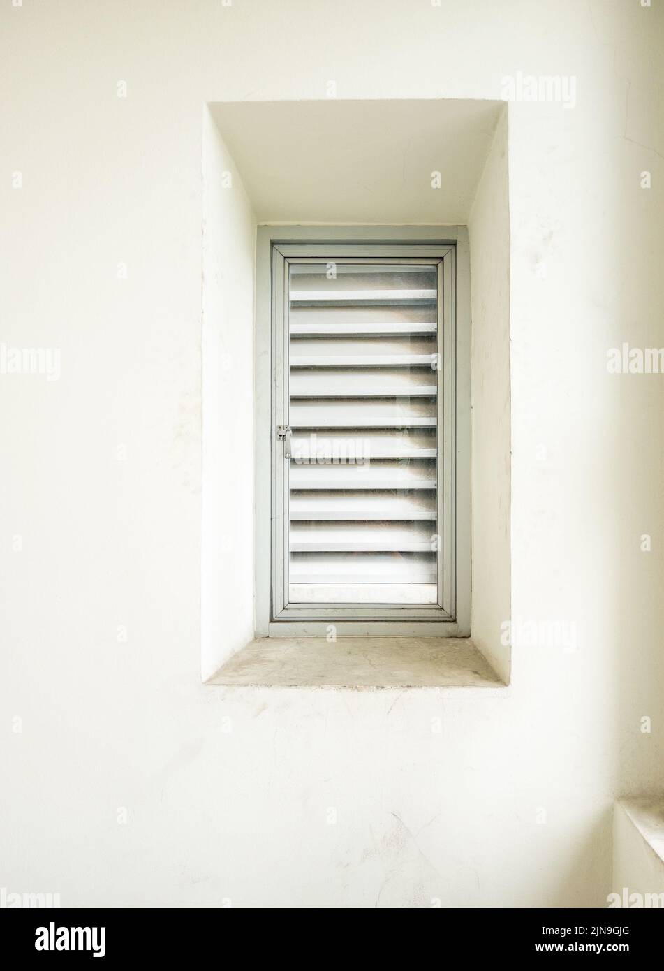 The ventilation louvers that are closed by glass panes on the white ...