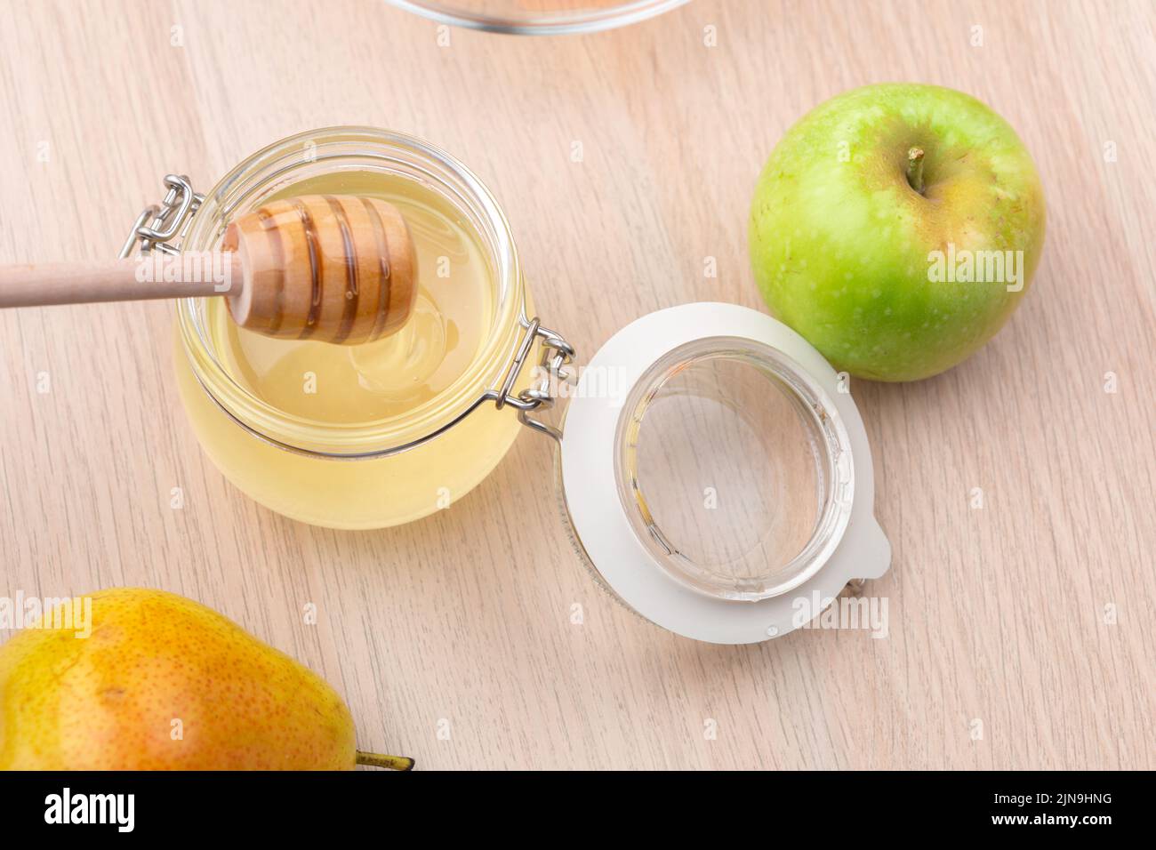 Jewish holiday Rosh Hashanah background with honey and apples on wooden ...