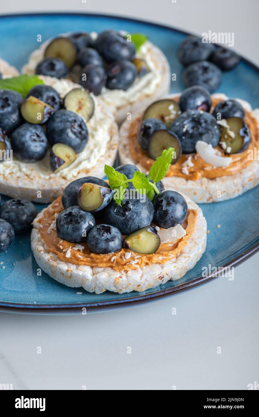 Healthy open sandwiches with blueberries Stock Photo - Alamy