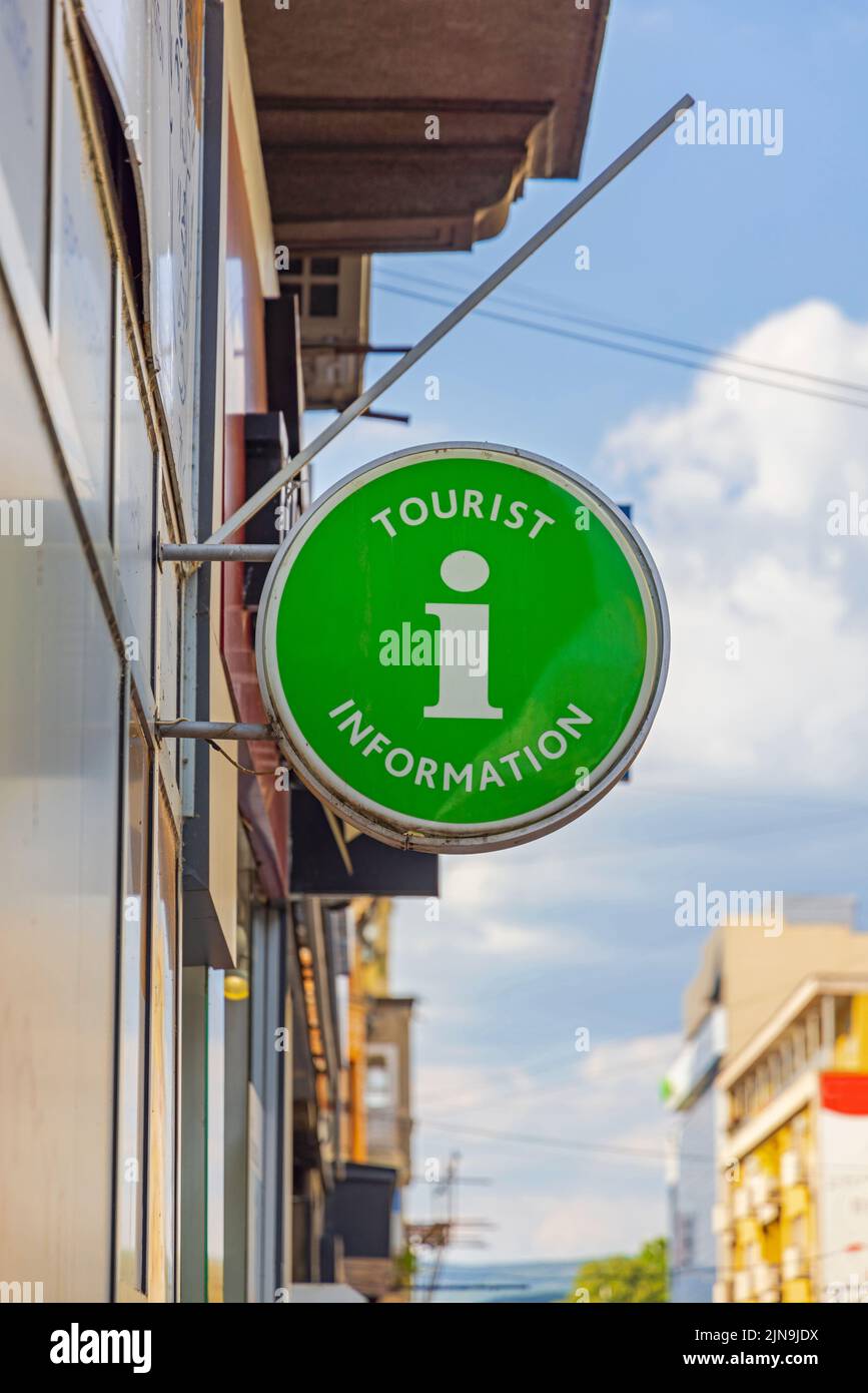 Tourist Information Illuminated Round Green Sign in City Stock Photo ...