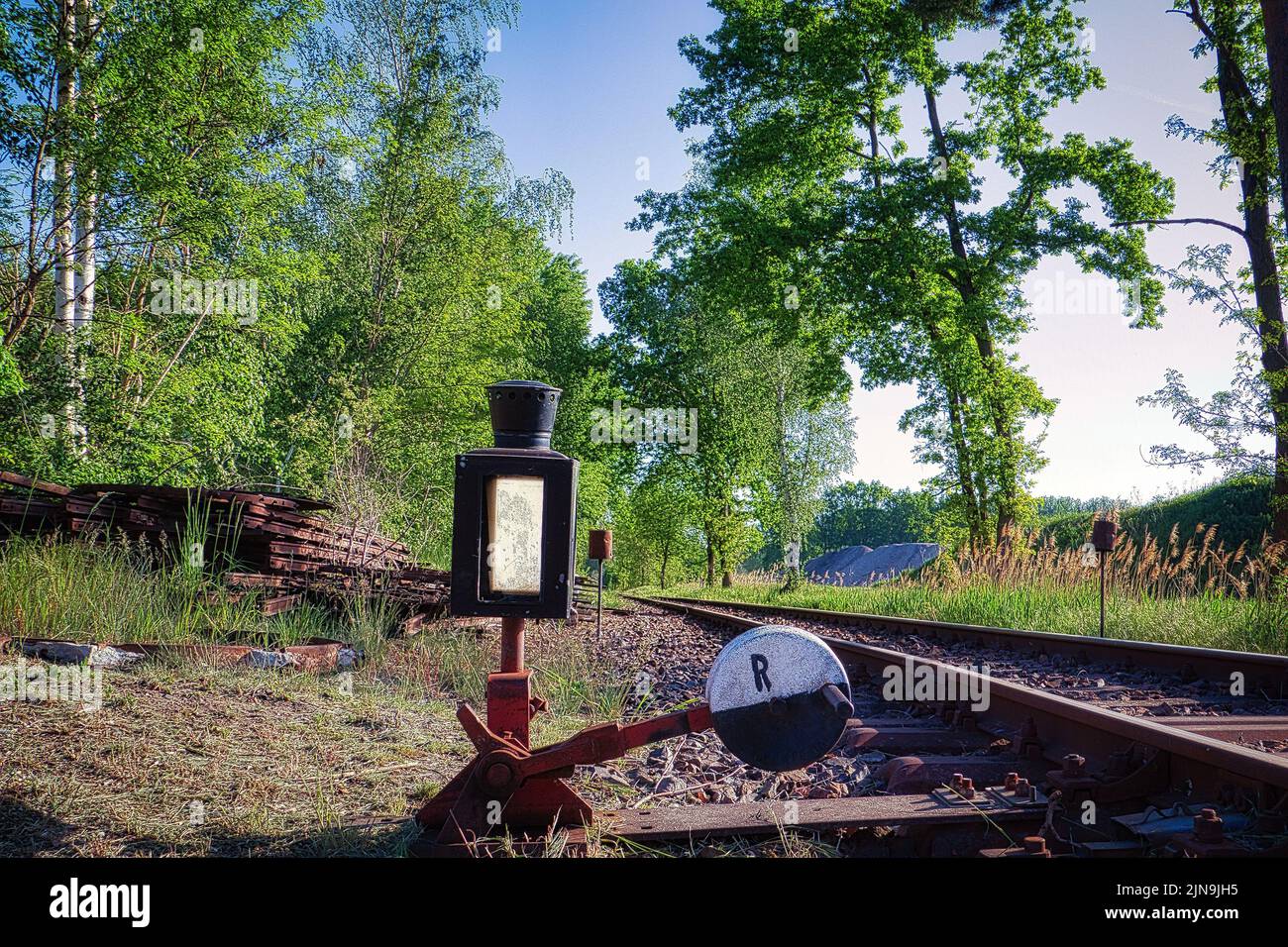 The railroad manual switch next to the tracks Stock Photo - Alamy