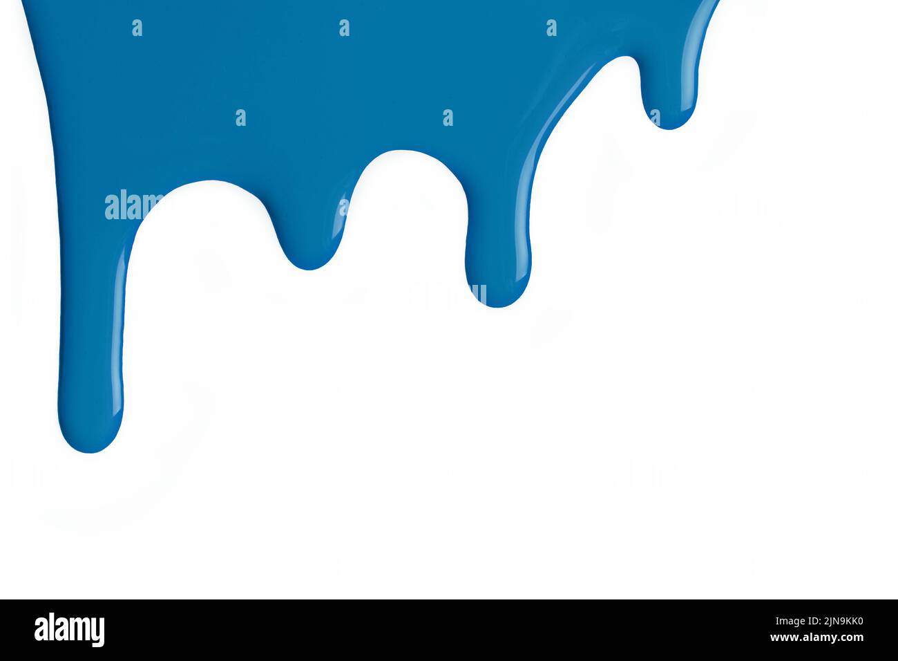 Light blue liquid drops of paint color flow down on isolated white ...