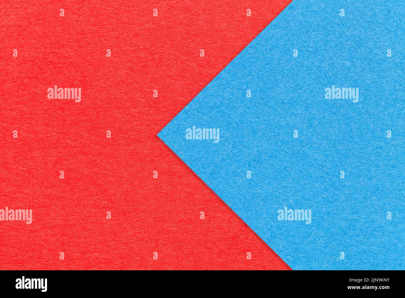 Texture of bright red and blue paper background, half two colors with ...