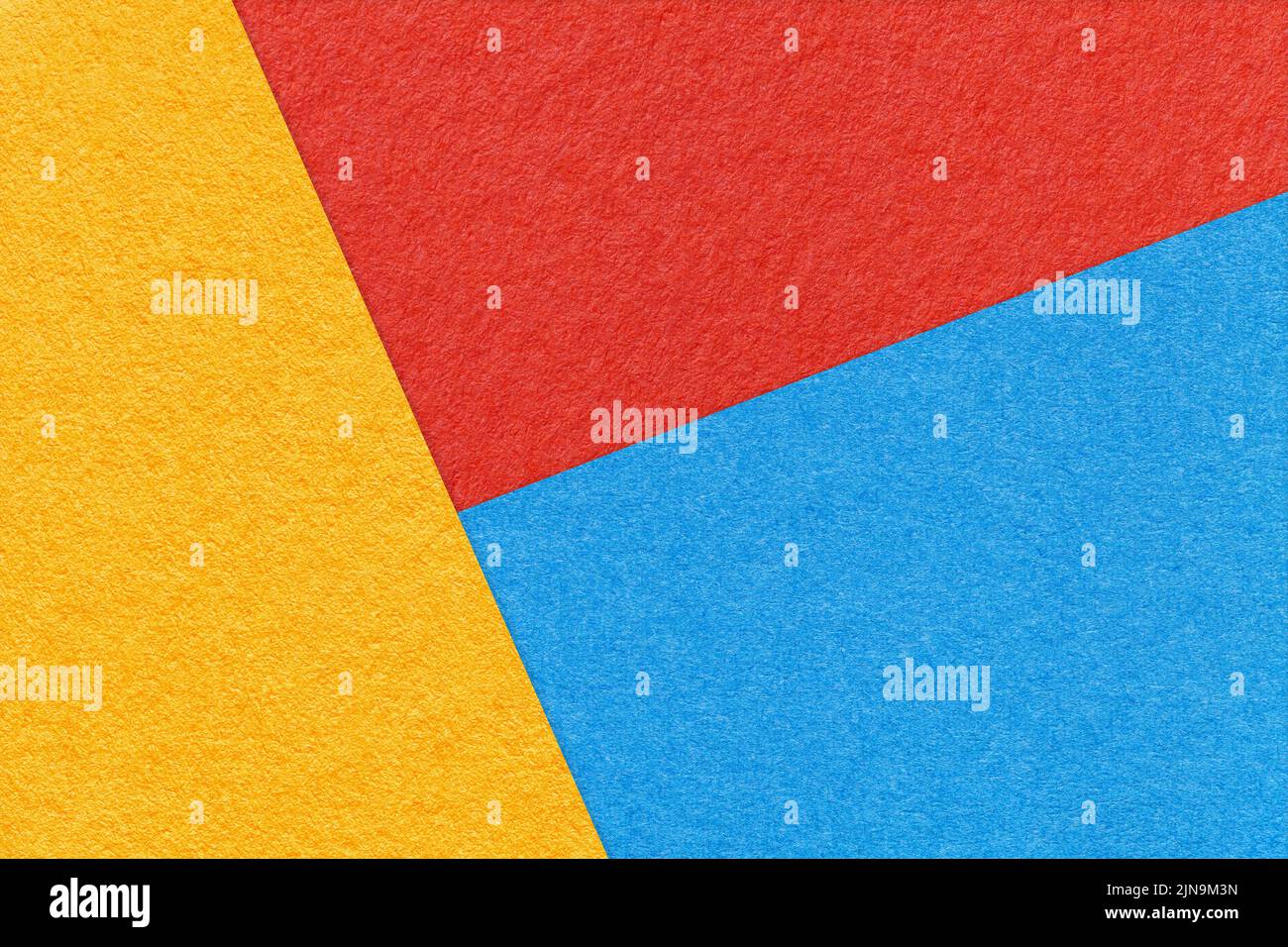 Texture of craft yellow, blue and bright red shade color paper ...