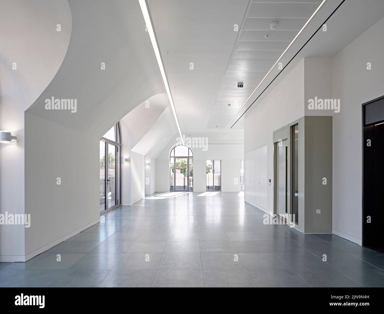 Unfurnished upper floor with arched windows and lift lobby. 30 St James ...