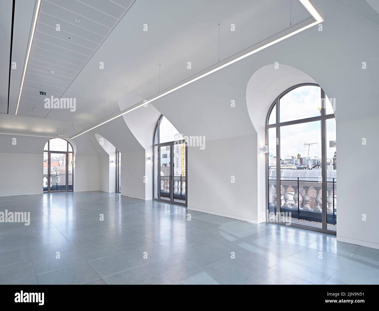 Unfurnished upper floor with arched windows and city view. 30 St James ...