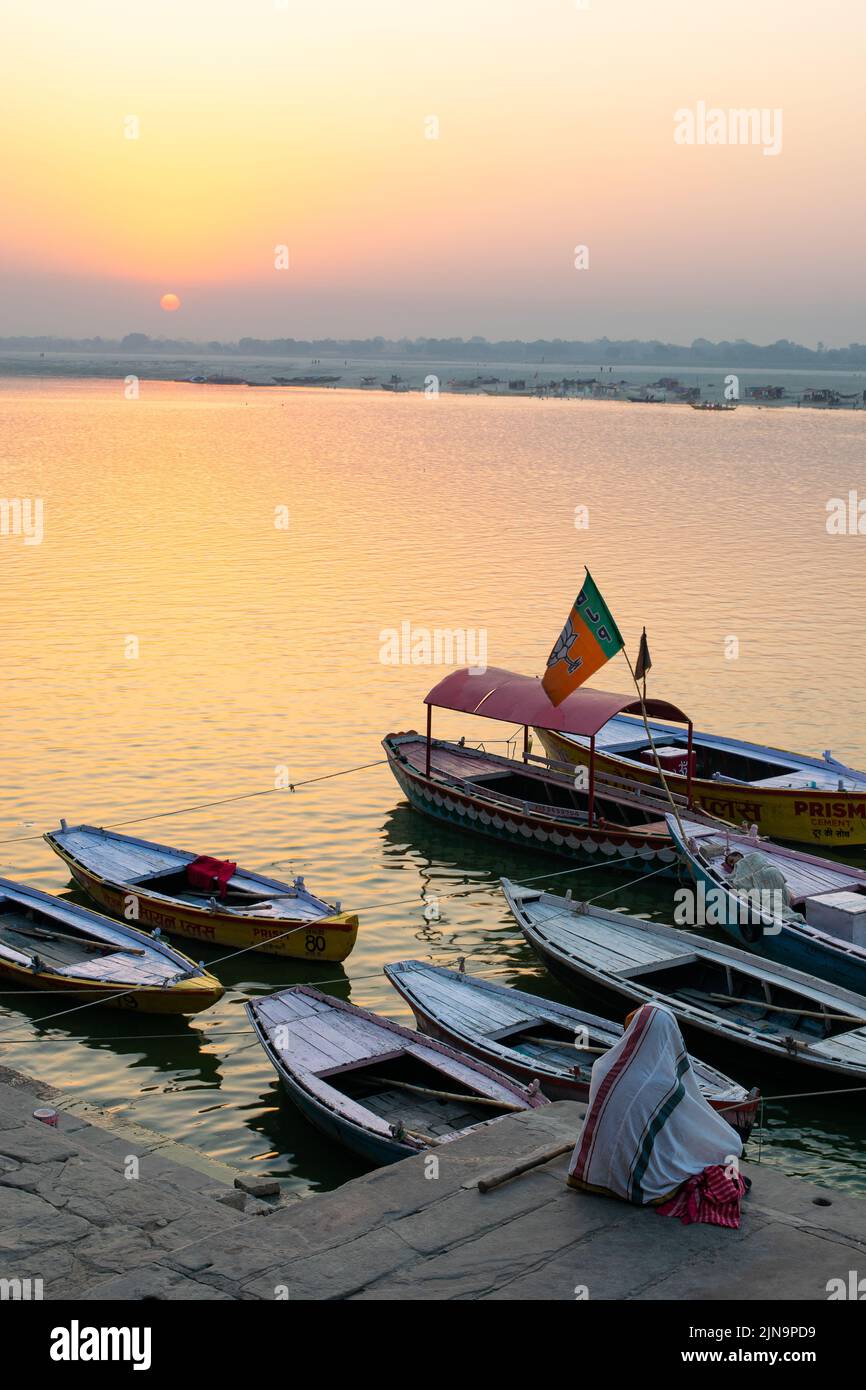 Beautiful sunrise in Varanasi ghat along Ganga river Stock Photo - Alamy