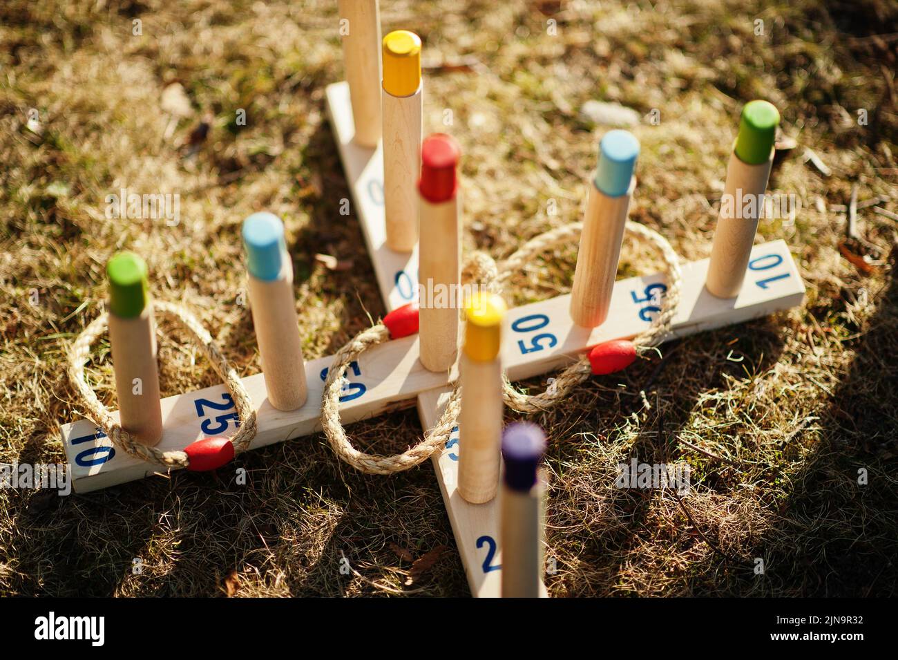 Traditional wooden ring toss set on a grass Stock Photo - Alamy
