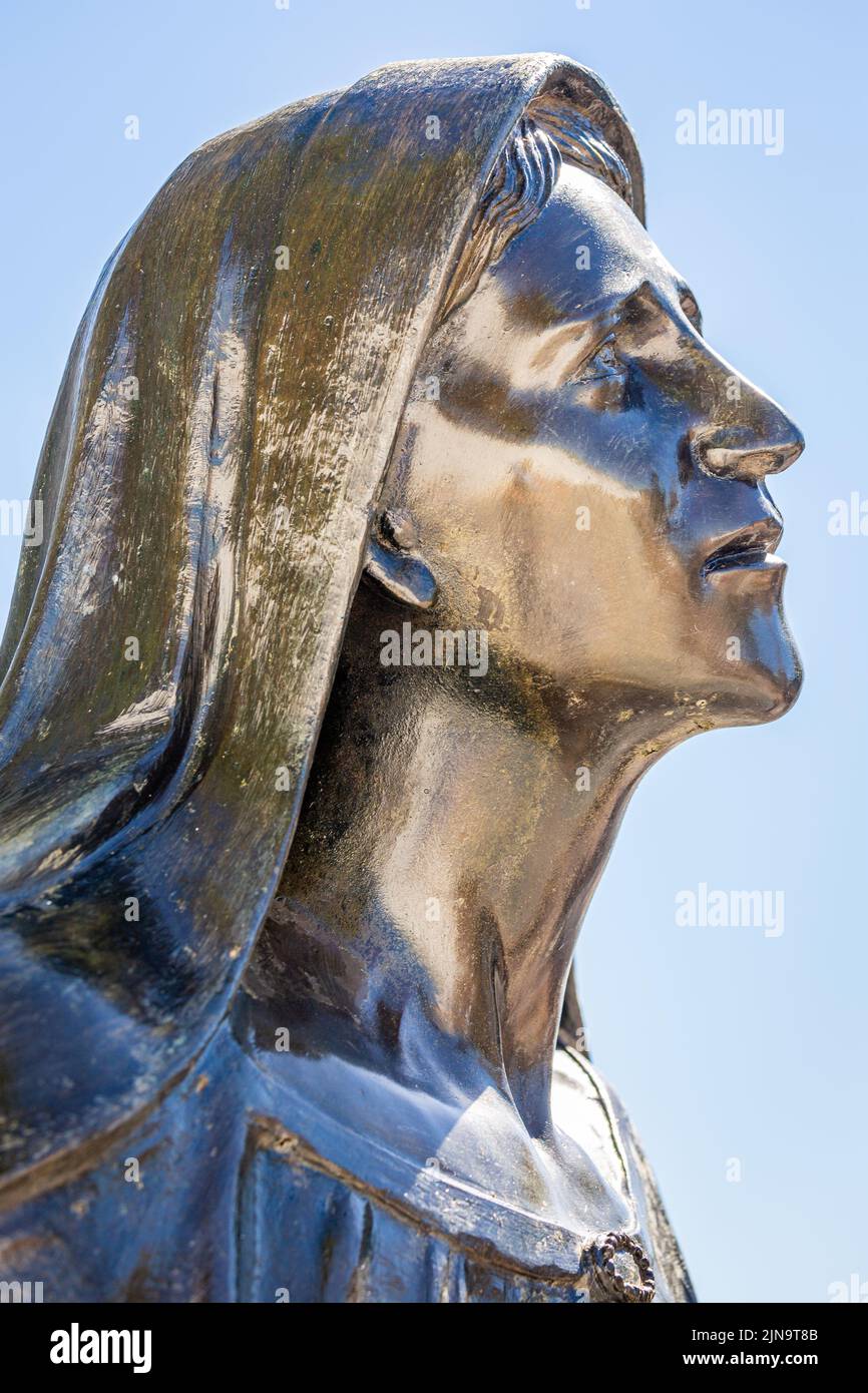 Virgin Mary praying with hands clasped for faith and hope of better ...