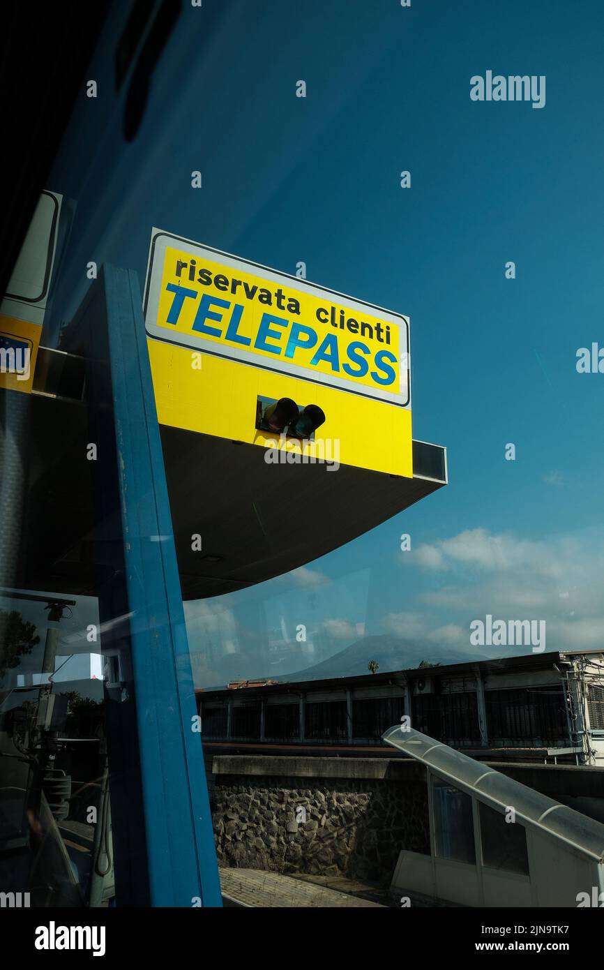 Telepass toll road signs as seen passing through from a coach window ...